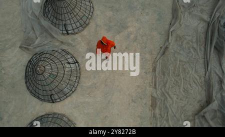 Aerial view of mounds of rice with giant hat-shaped bamboo cones ...