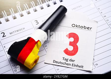 Tröte in deutschen Nationalfarben und Kalenderblatt vom 3. Oktober, Tag ...
