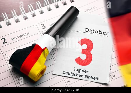 Tröte in deutschen Nationalfarben und Kalenderblatt vom 3. Oktober, Tag ...