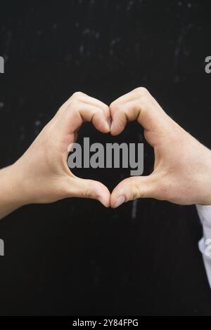 Two hands form a heart shape Stock Photo - Alamy