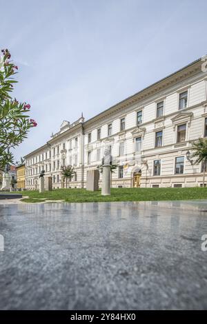 A beautiful shot of historic buildings and people walking around in ...