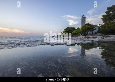A beautiful shot of buildings in forested mountains by a lake Stock ...