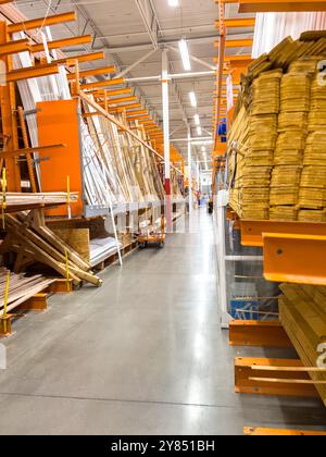 Lumber and Fencing Aisle in a Hardware Store with Wood Planks and ...