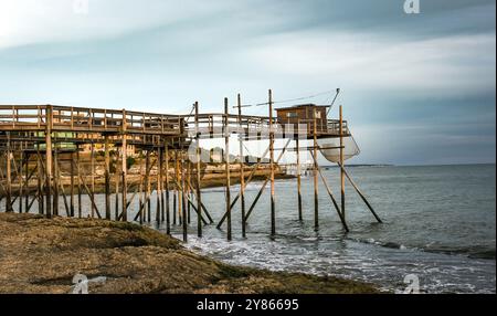 Traditional fisherman hut on stilts with carrelet fishing net. Wooden ...