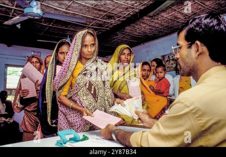Bangladesh, Manikganj, women receiving a credit loan from Grameen bank ...