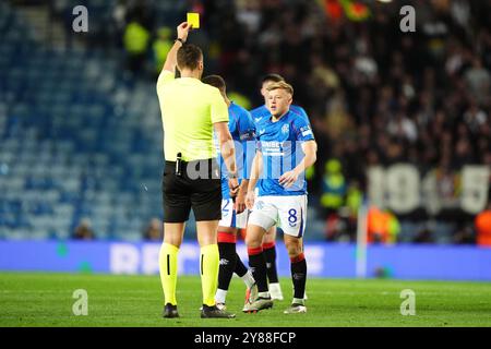 Rangers' Connor Barron is shown a yellow card by referee David ...