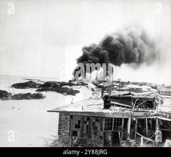 Smoke rises from a damaged building in Tehran, Iran, early Friday, June ...