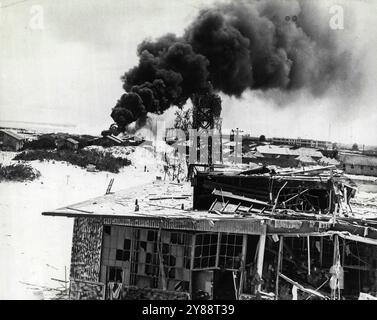 FILE - Smoke rises from a fire after a small medical plane crashed in a ...