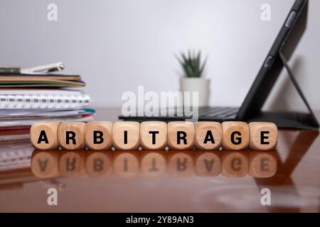 ARBITRAGE word made with building blocks Stock Photo - Alamy