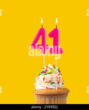 Yellow birthday cupcake with a number 41 candle - Birthday card on a ...
