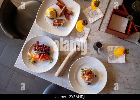 Colorful variety of breakfast foods on table from above Stock Photo - Alamy