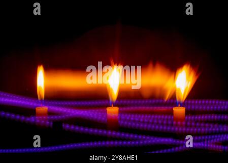 Low shutter speed one candle Stock Photo - Alamy