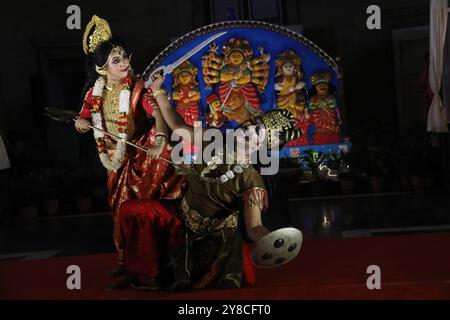 Dancers perform the ''Durgotsab'' dance dressed as goddess Durga and a ...