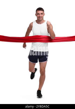 Man in sportswear crossing red finish line on white background Stock ...