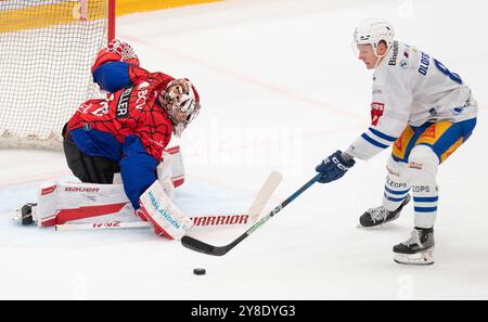 Fredrik Olofsson #8 (EV Zug) and goalkeeper Niklas Schlegel #34 (HC ...
