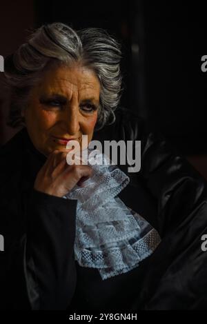 Thoughtful senior female judge in a courtroom, considering a legal case ...