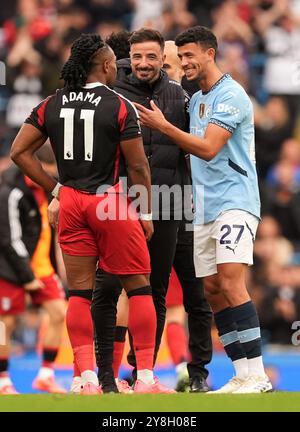 Fulham's Adama Traore and Manchester City's Ruben Dias (right) battle ...