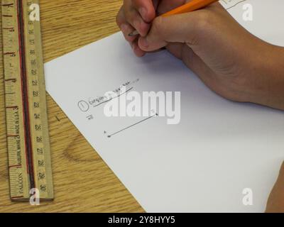 Elementary work by students learning geomery and how to use a ruler to ...