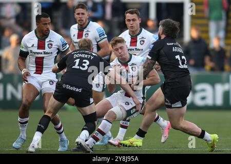 Newcastle Falcon's Sammy Arnold, is tackled during the Premiership Cup ...