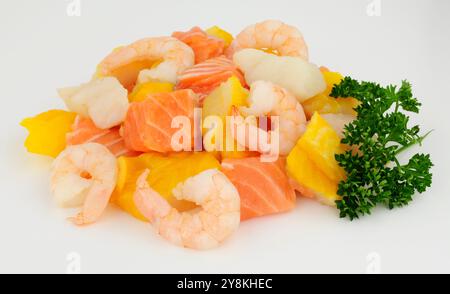 Group of fresh raw prawns, salmon, cod and smoked haddock chunks ...