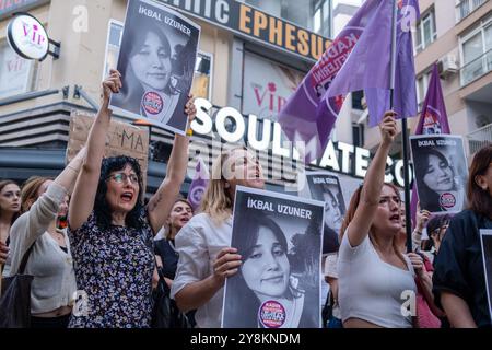 Izmir, Turkey. 05th Oct, 2024. A woman holds up the Ikbal Uzuner's ...