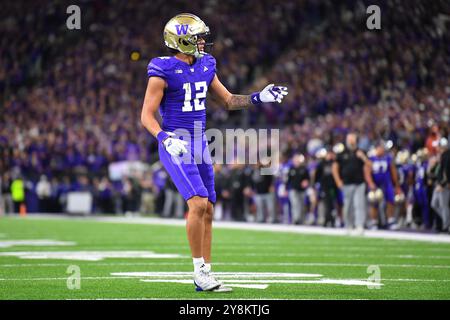 Washington wide receiver Denzel Boston (12) reacts after scoring a ...
