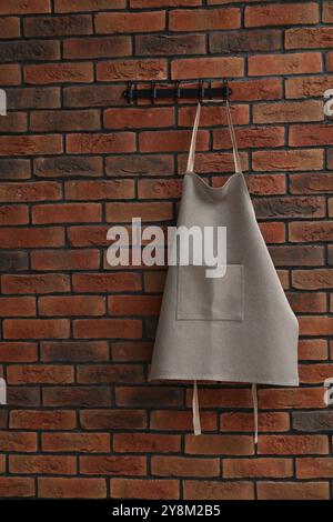 Work apron hanging on wall Stock Photo - Alamy
