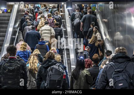 Public transport, underground, main station exit, many people crowding ...