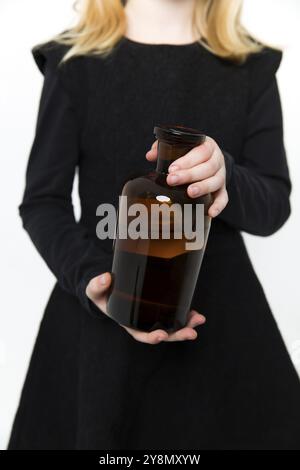 Poison in children's hands Stock Photo - Alamy