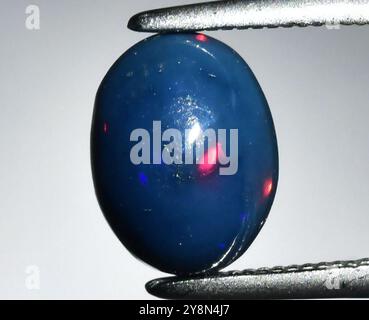 Captivating Opal Gemstone with Iridescent Colors and Unique Inclusions ...