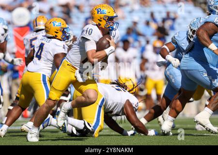 Pittsburgh quarterback Eli Holstein (10) scores during the second half ...