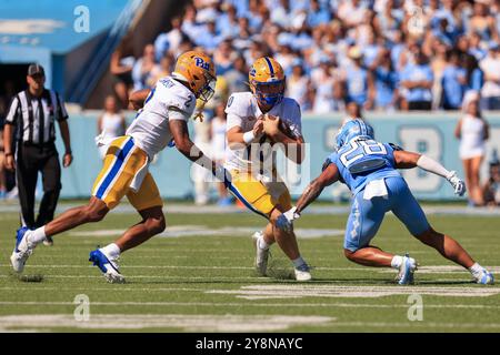 Pittsburgh quarterback Eli Holstein (10) scores during the second half ...