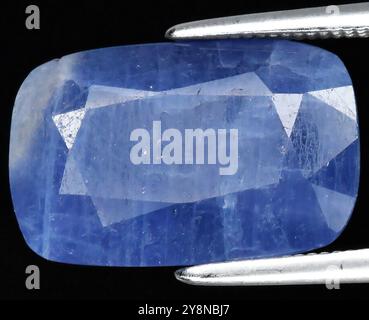 Stunning Deep Blue Gemstone with Intricate Faceting and Glossy Finish ...