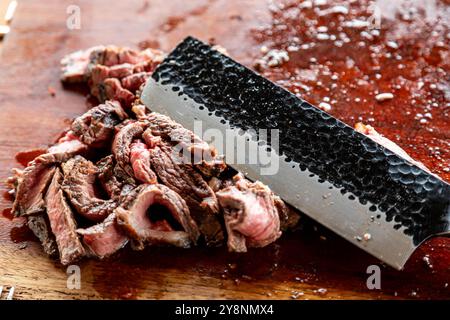 Rustic handcrafted cleaver with wooden handle and textured finish Stock ...