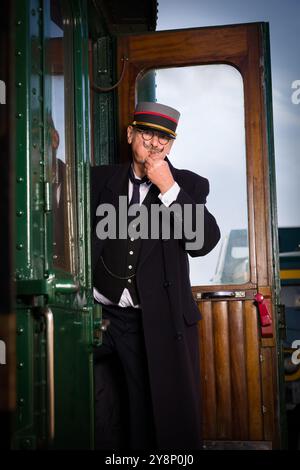 Reenactment scene with authentic 1927 1st class train carriage and a ...