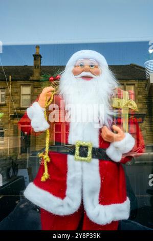 A model of Santa Claus in a shop window display Stock Photo - Alamy