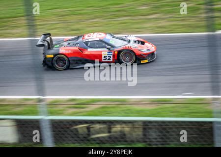 High-Speed Action at Monza Circuit: Dynamic Racing Car Captured in ...