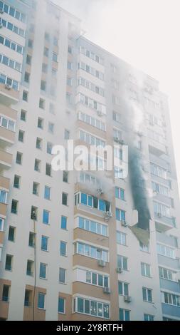 Smoke and flames rise from a tower building as it is destroyed by ...