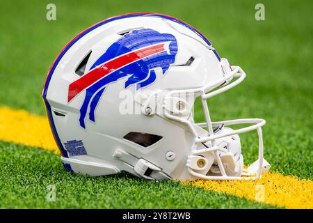 Buffalo Bills helmet sits on the field with some footballs during an ...