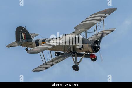 Two Fairey Swordfish Mk I aircraft of the Fleet Air Arm are loaded with ...