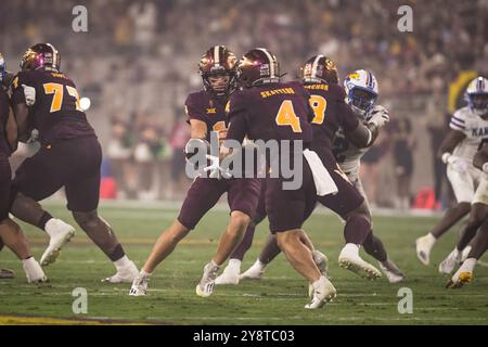 Cam Skattebo and Arizona State quarterback Sam Leavitt (10) watch from ...