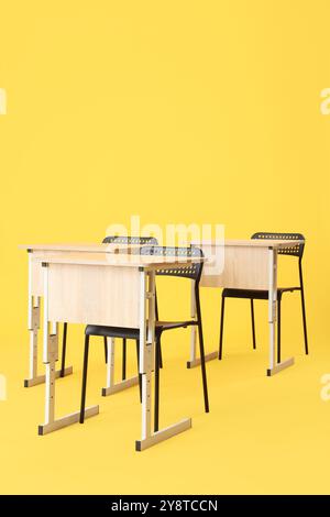 A school classroom with desks and chairs and yellow window blinds Stock ...