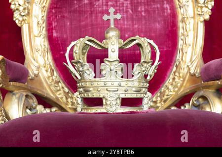 Ancient crown on red velvet. Antique symbol of authority, luxury ...