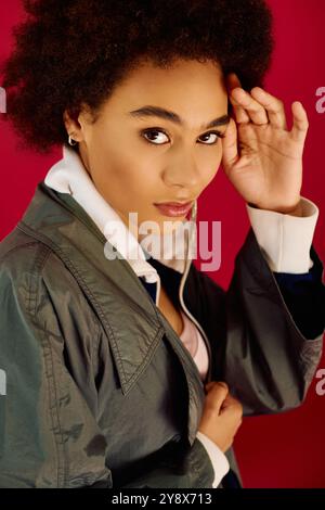 A young woman showcases deep emotion while striking a dynamic pose ...