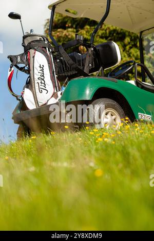 golf buggy x 3 close up inside steering wheels Stock Photo - Alamy