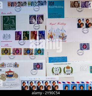 A collection of colorful British commemorative stamps and first day ...
