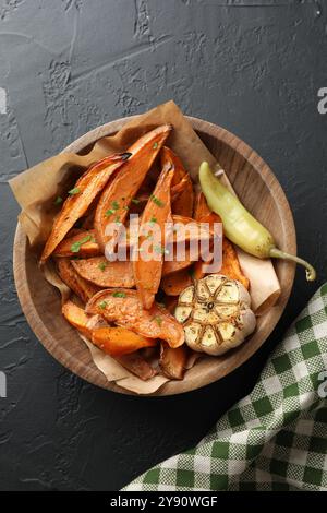 Top view of delicious sweet pickled fruit in plastic cup with wooden ...