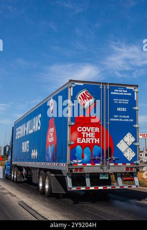 Sherwin-Williams Paints sign on exterior of white building under clear ...