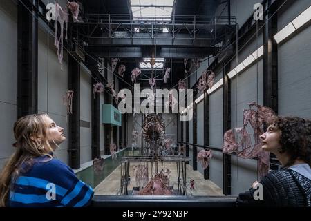 Open Wound with fabric hanging sculptures and mechanical installations ...