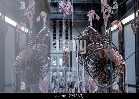 Open Wound with fabric hanging sculptures and mechanical installations ...
